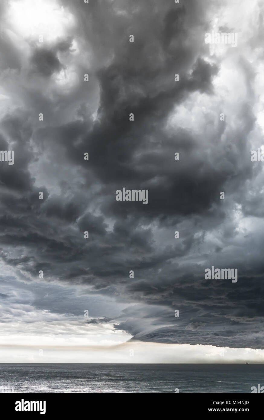 Stormy rain clouds over sea hi-res stock photography and images - Alamy