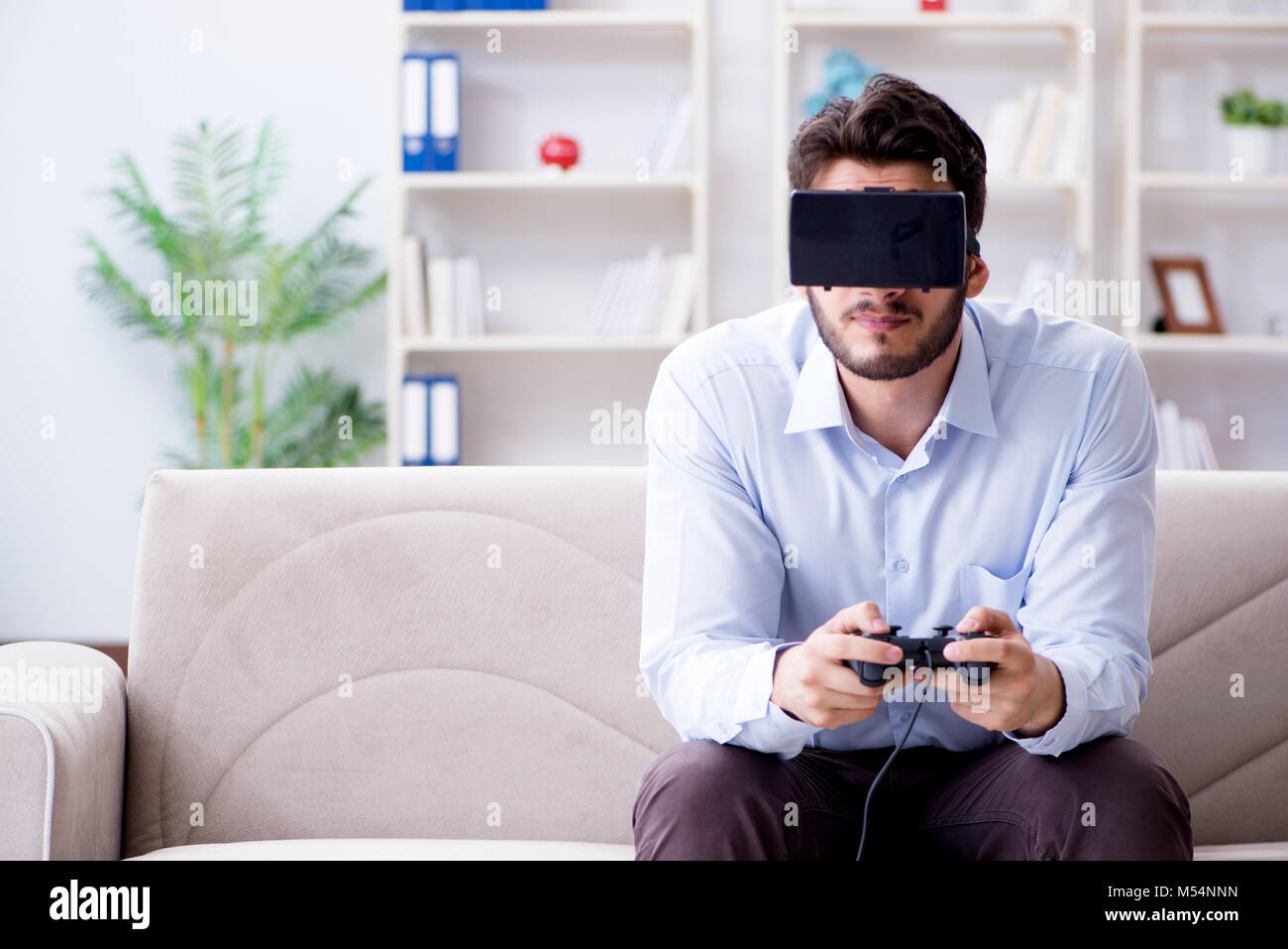 Student gamer playing games at home Stock Photo - Alamy