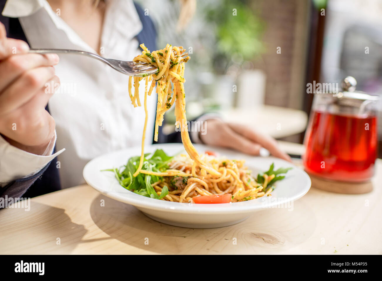 Spaghetti eating by hands hi-res stock photography and images - Alamy
