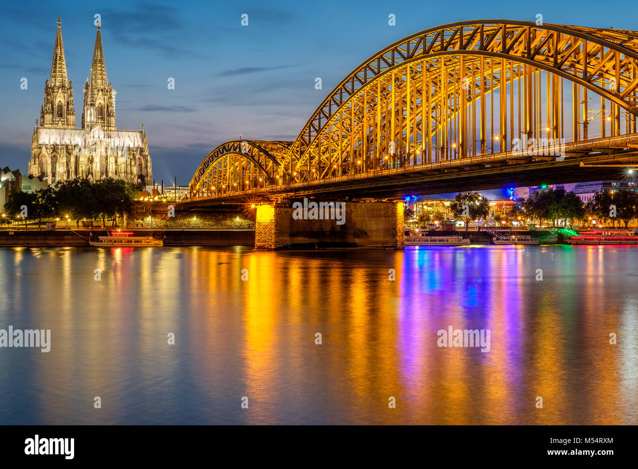 Cologne Cathedral and Hohenzollern Bridge at night, Germany Stock Photo ...
