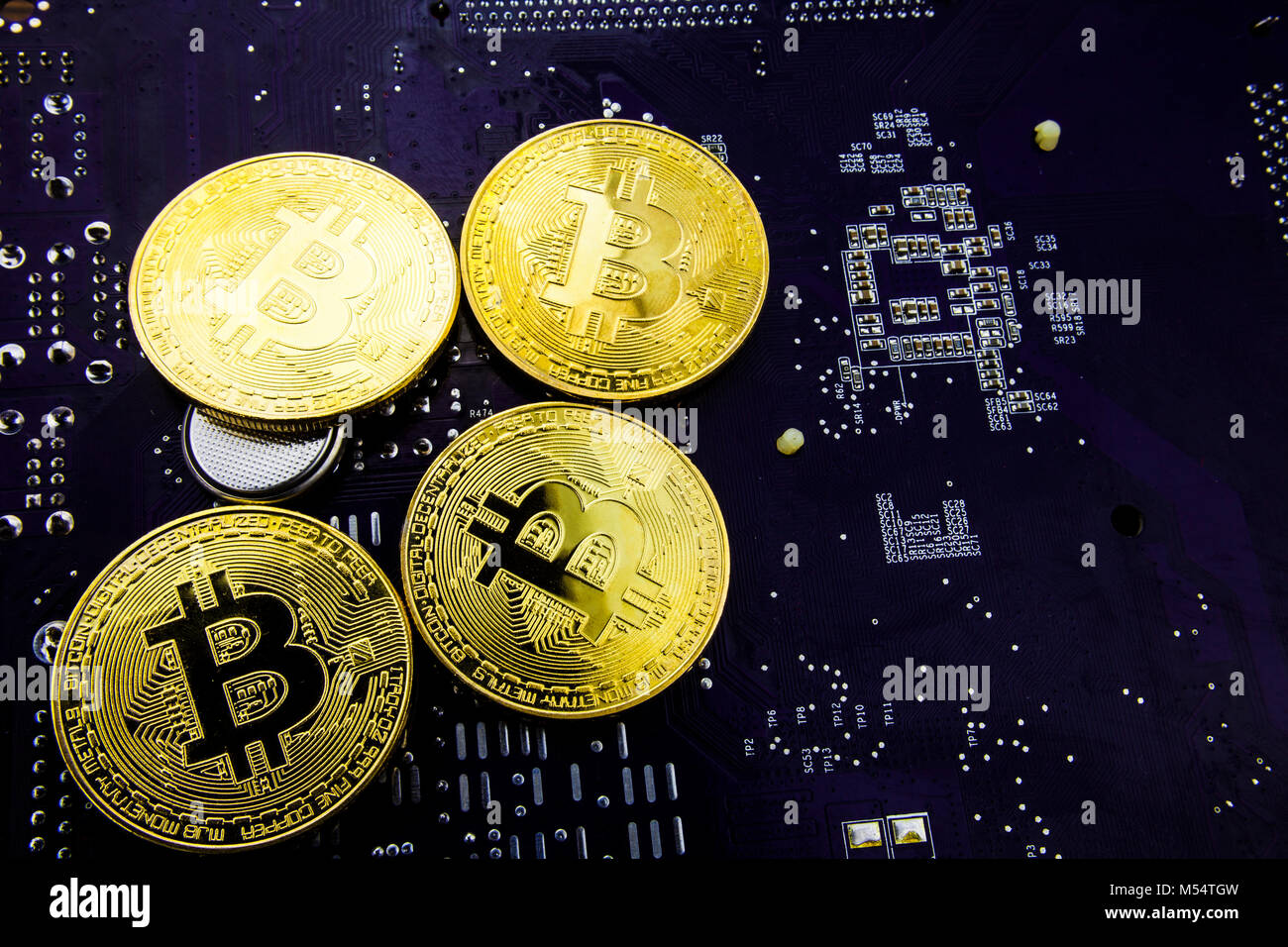 Cryptocurrency Bitcoin On The Motherboard. Gold Coin. Virtual Currency ...