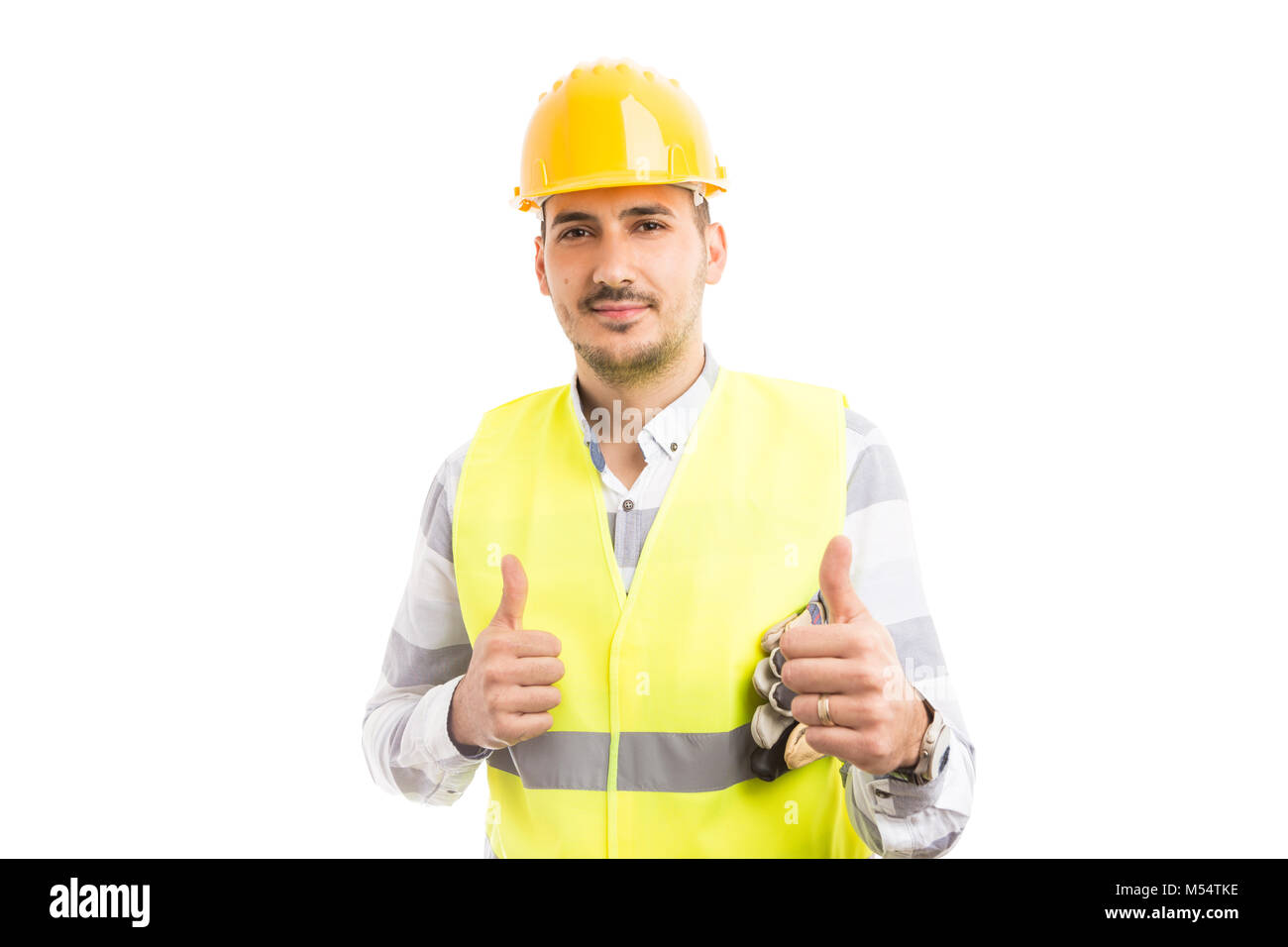 Smiling confident handsome constructor showing double like or thumbs-up ...