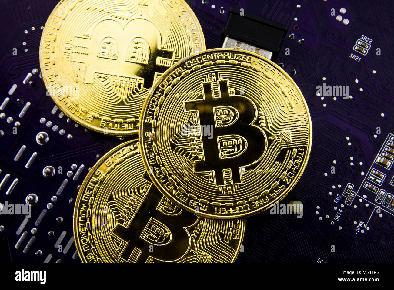 Cryptocurrency Bitcoin On The Motherboard. Gold Coin. Virtual Currency ...