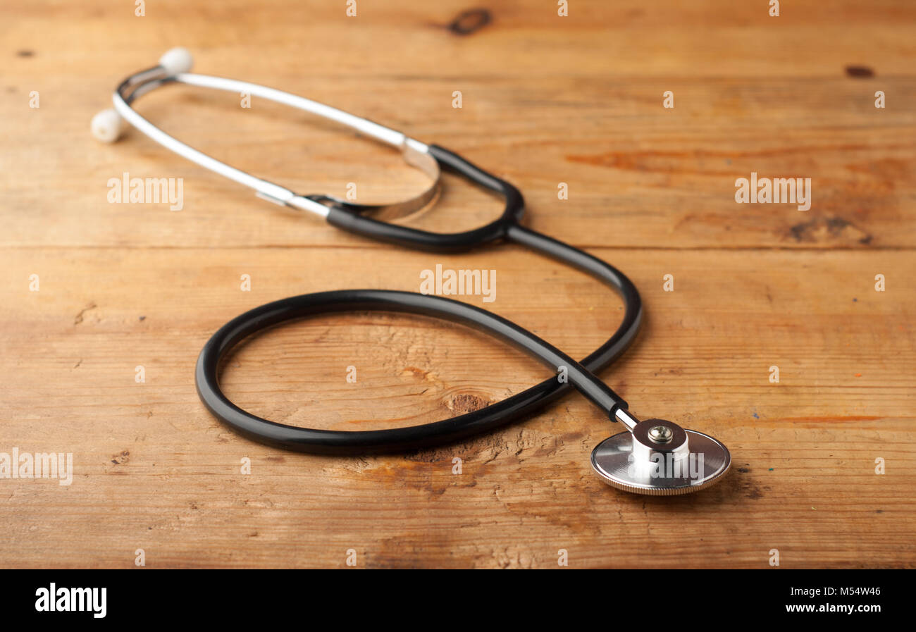 Stethoscope on wooden background or vintage table. Selective focus, the ...