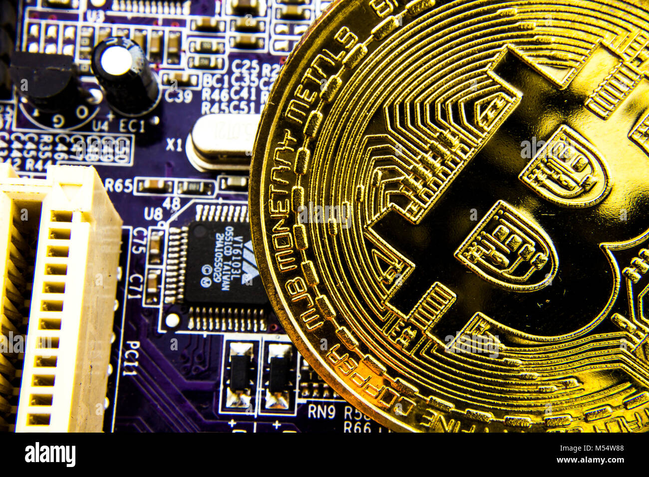 Cryptocurrency Bitcoin On The Motherboard. Gold Coin. Virtual Currency ...