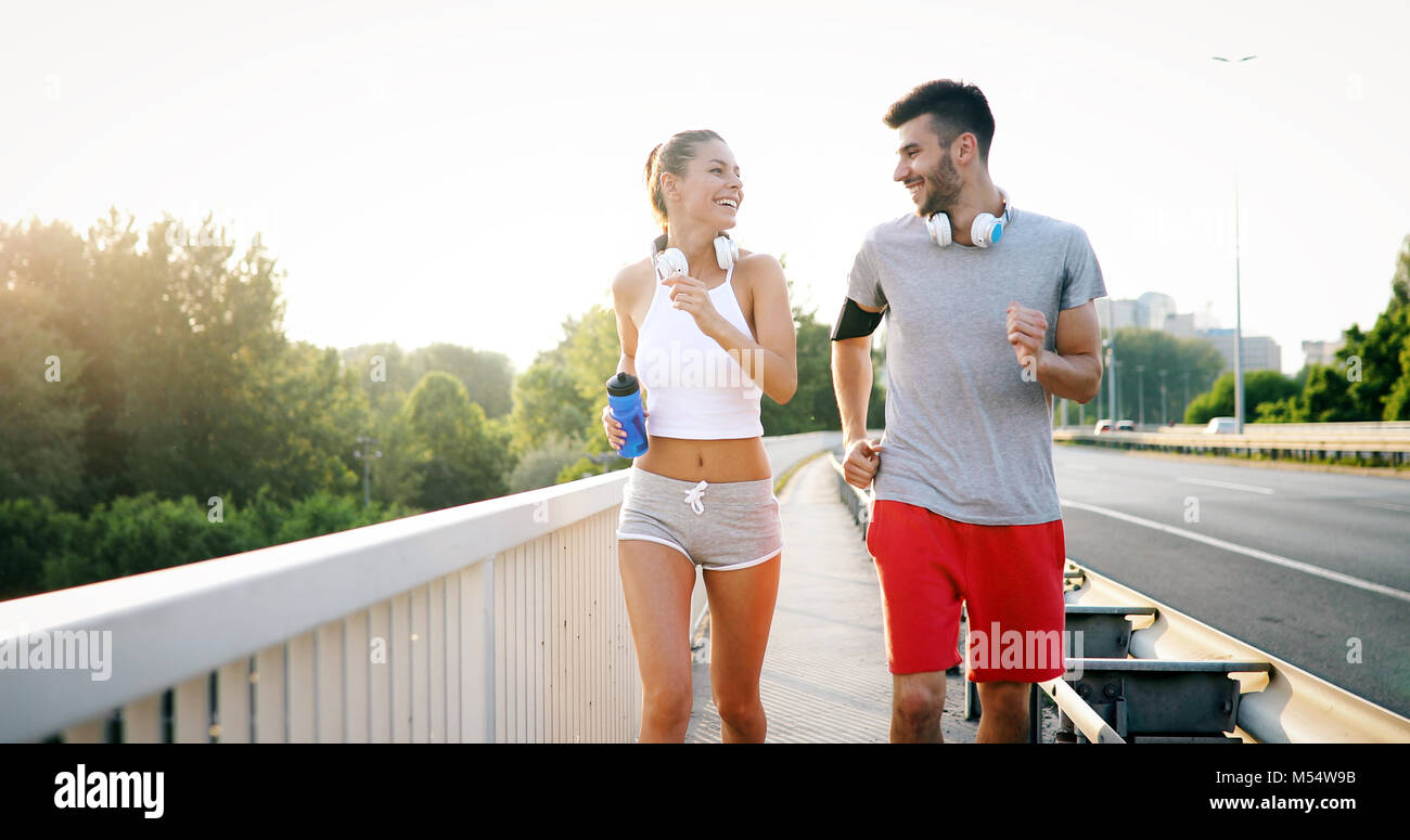 Beautiful couple jogging in nature Stock Photo - Alamy