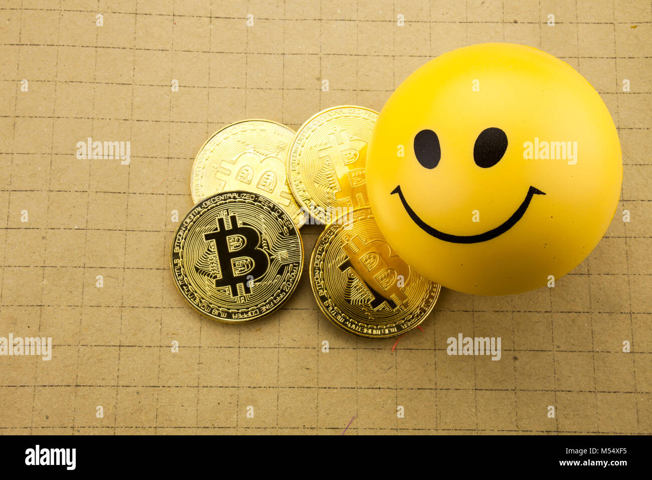 Bitcoins and smile ball. Smily ball. Happy Stock Photo - Alamy