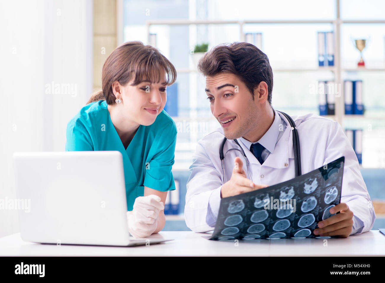 Two doctors discussing patient mri hi-res stock photography and images ...