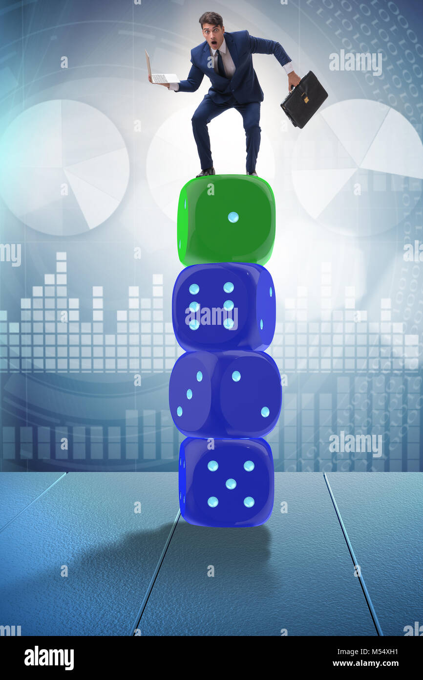 Businessman balancing on top of dice stack in uncertainty concep Stock ...
