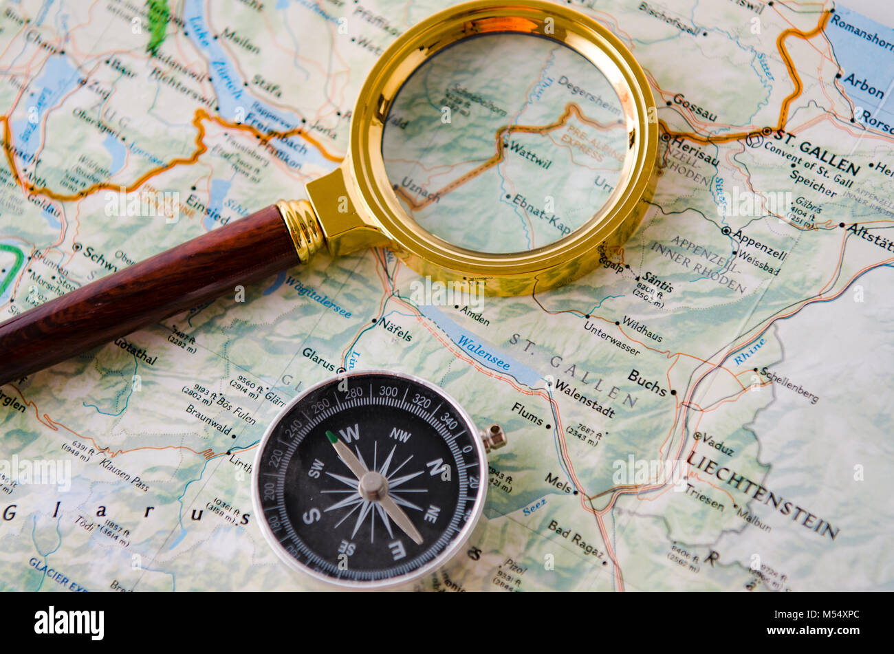The travel concept with compass and map Stock Photo - Alamy