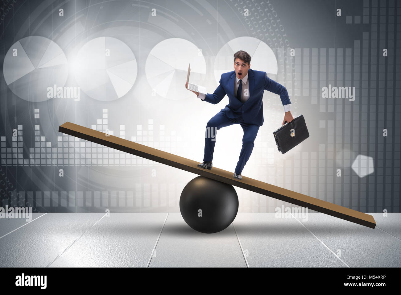 Businessman trying balance on hi-res stock photography and images - Alamy