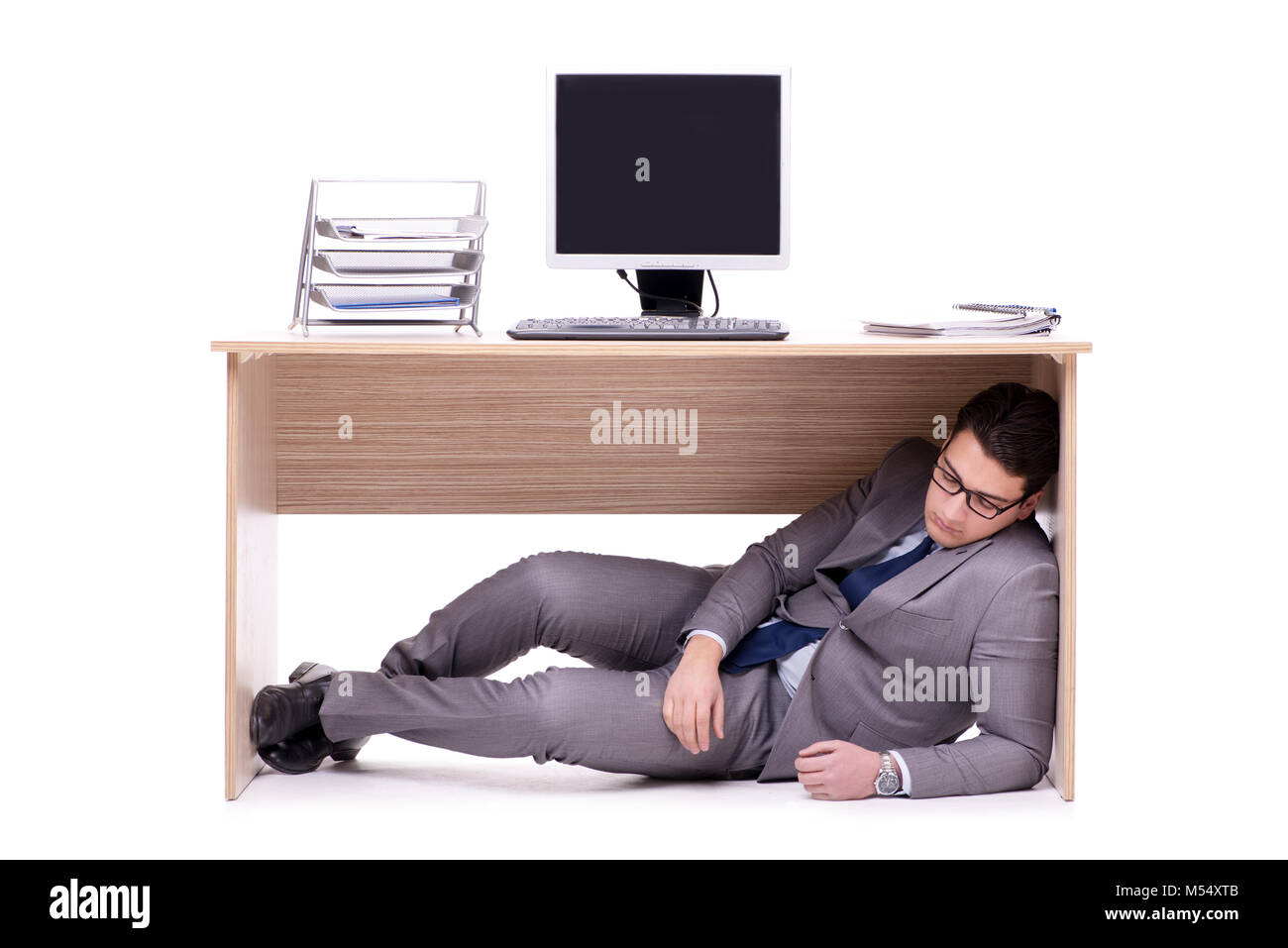 Person hiding under desk Cut Out Stock Images & Pictures - Alamy