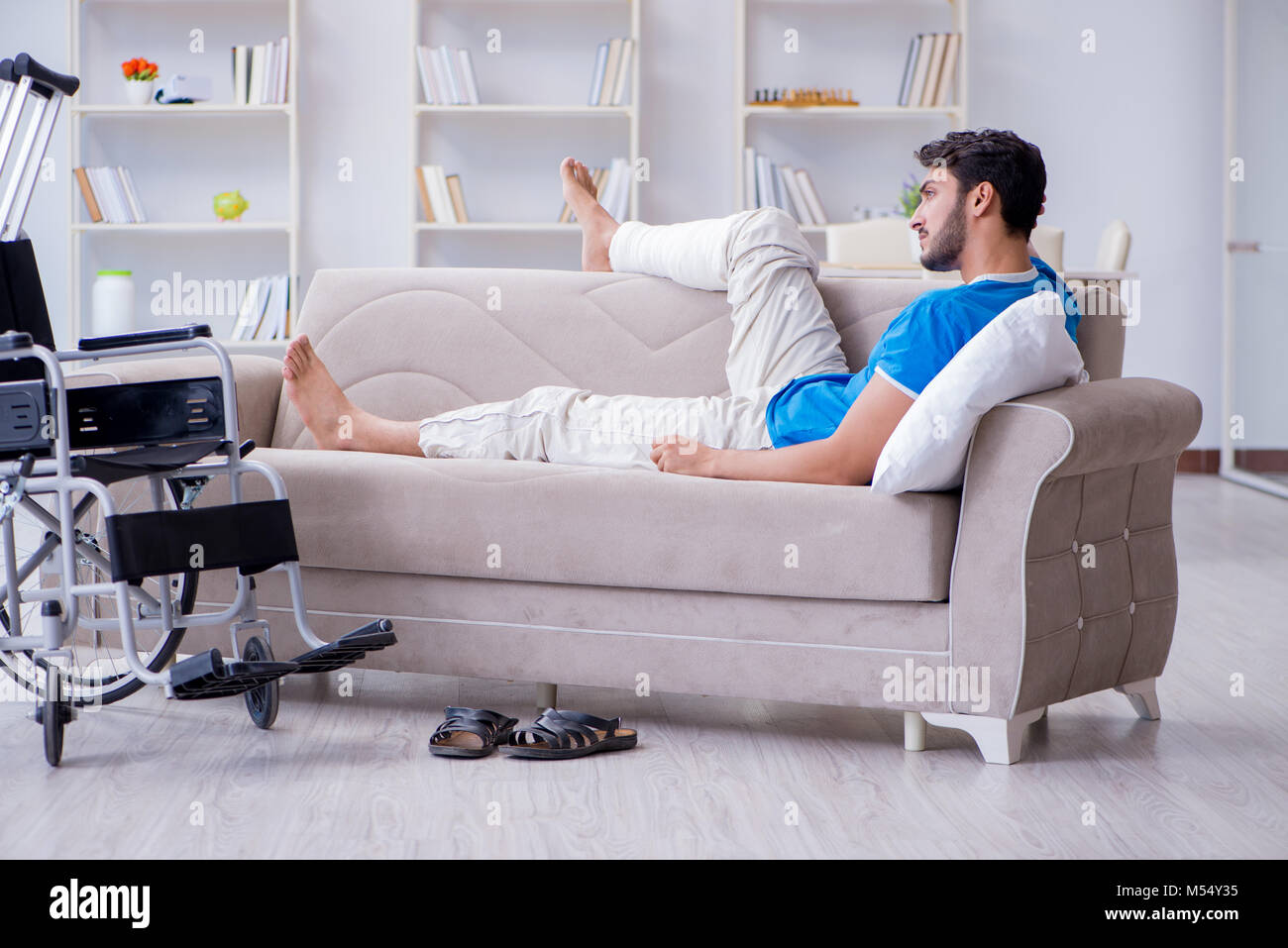 The injured young man recovering at home Stock Photo - Alamy