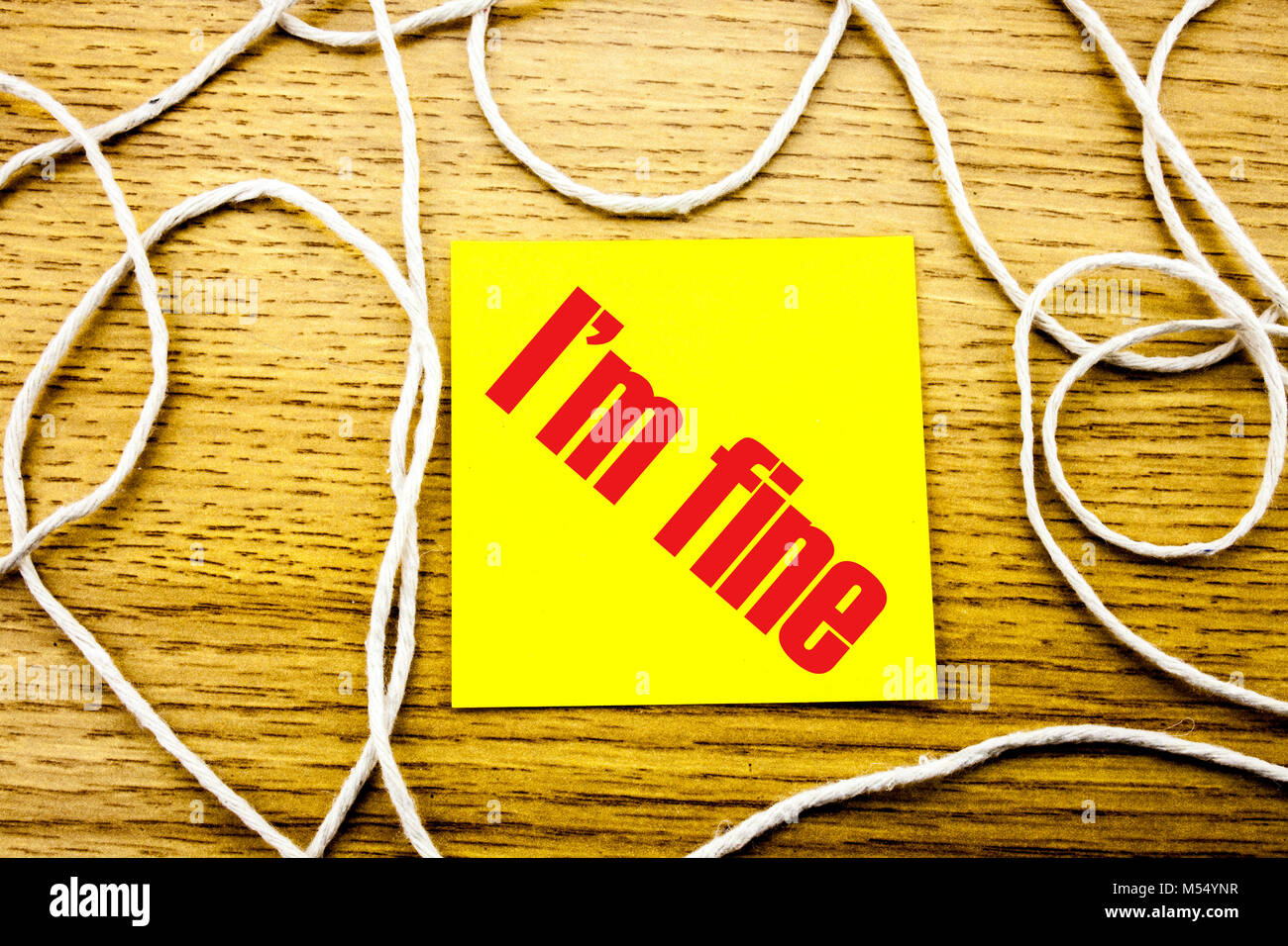 I am fine word on yellow sticky note in wooden background. Bussines ...