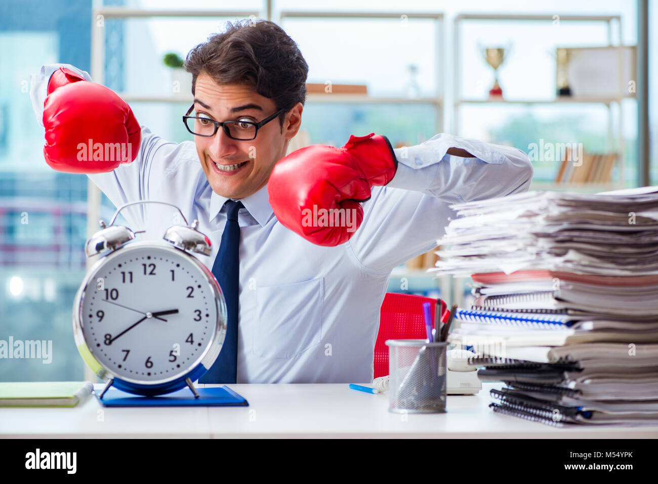 The businessman with boxing gloves in the office Stock Photo - Alamy