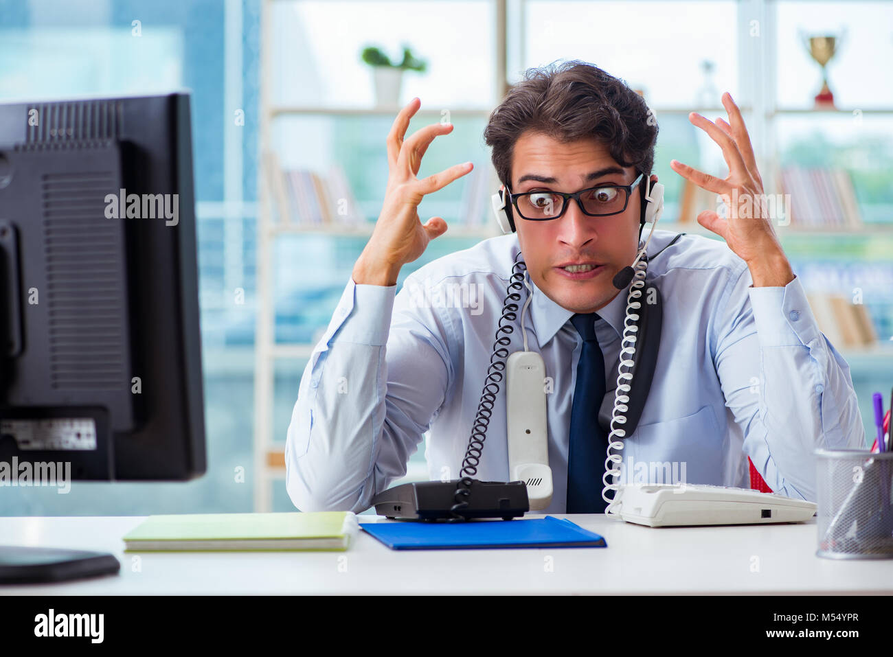 The unhappy angry call center worker frustrated with workload Stock ...