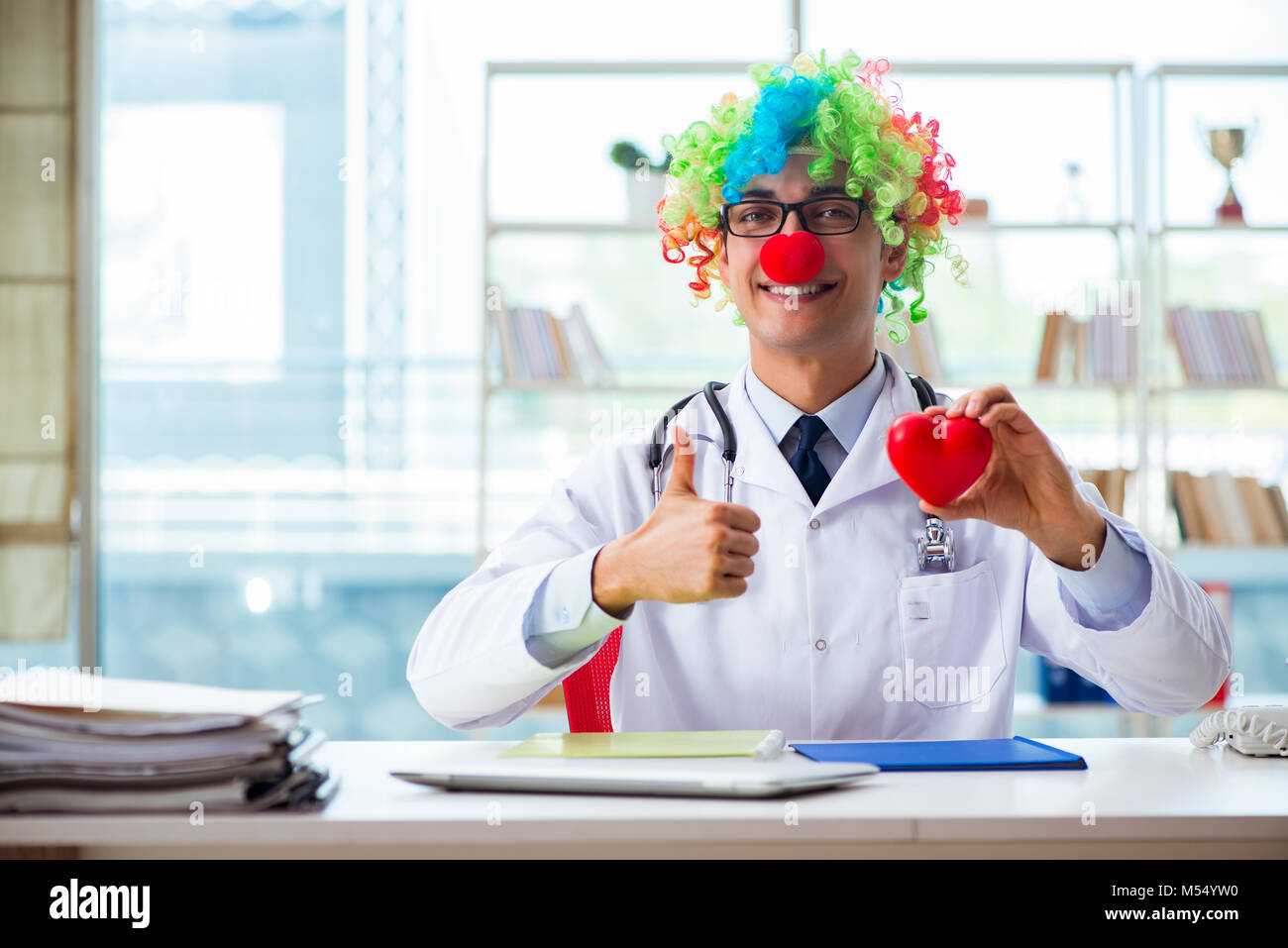 The child cardiologist with stethoscope and red heart Stock Photo - Alamy
