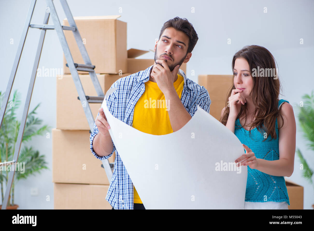 The young family planning home refurbishing in diy concept Stock Photo ...