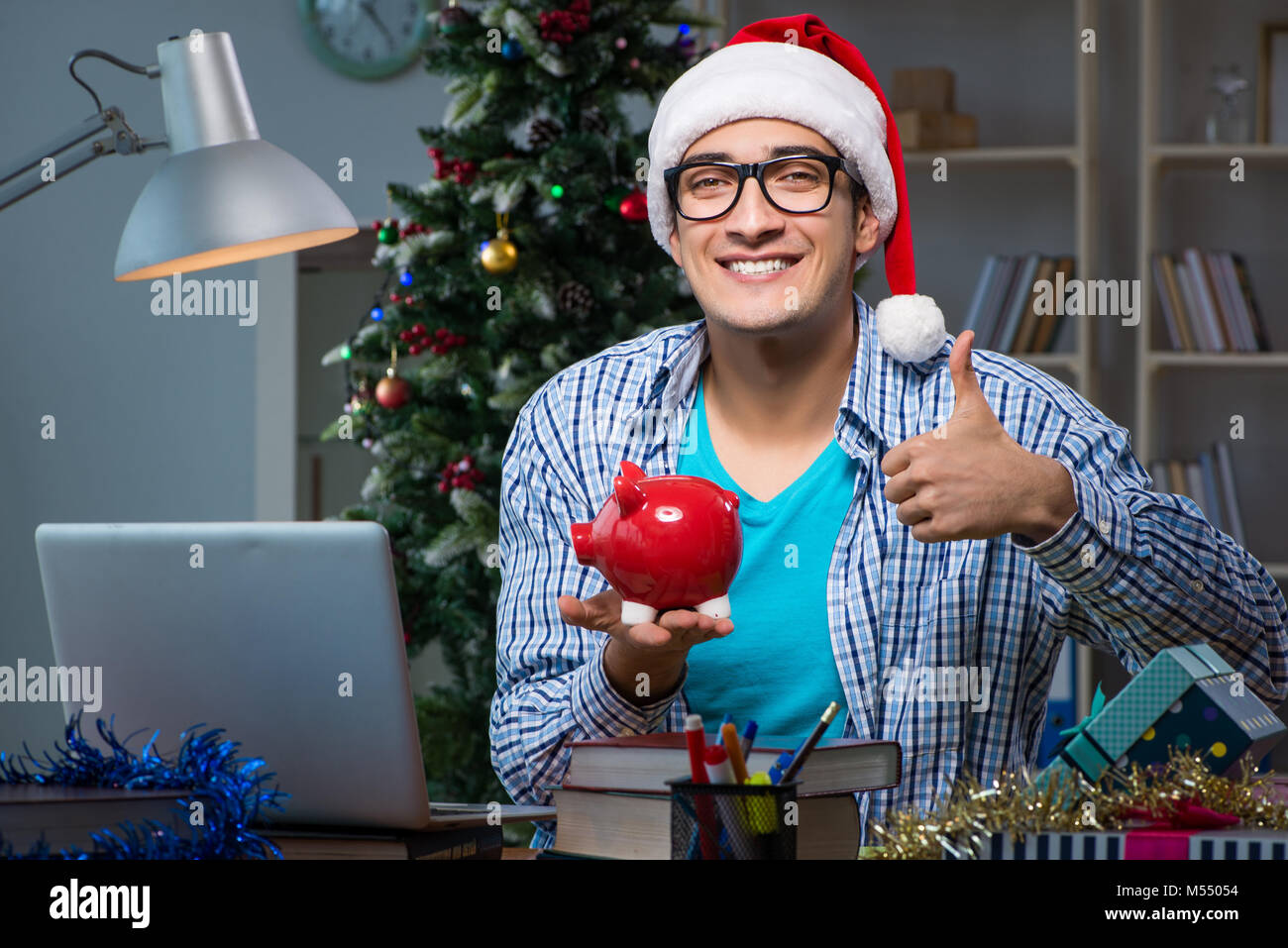 The young man working at home on christmas day Stock Photo - Alamy