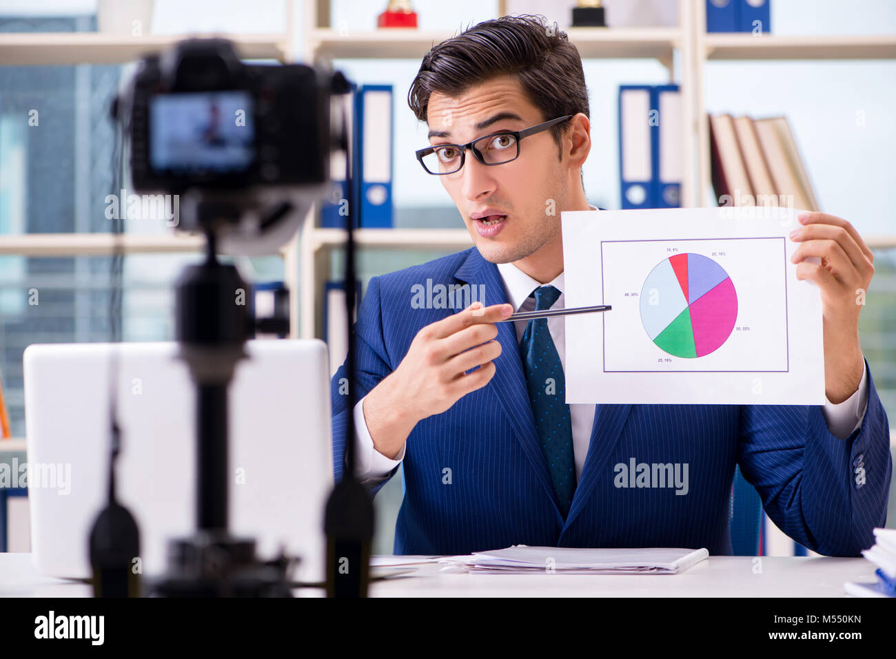 Businessman recording a video for vlog Stock Photo - Alamy