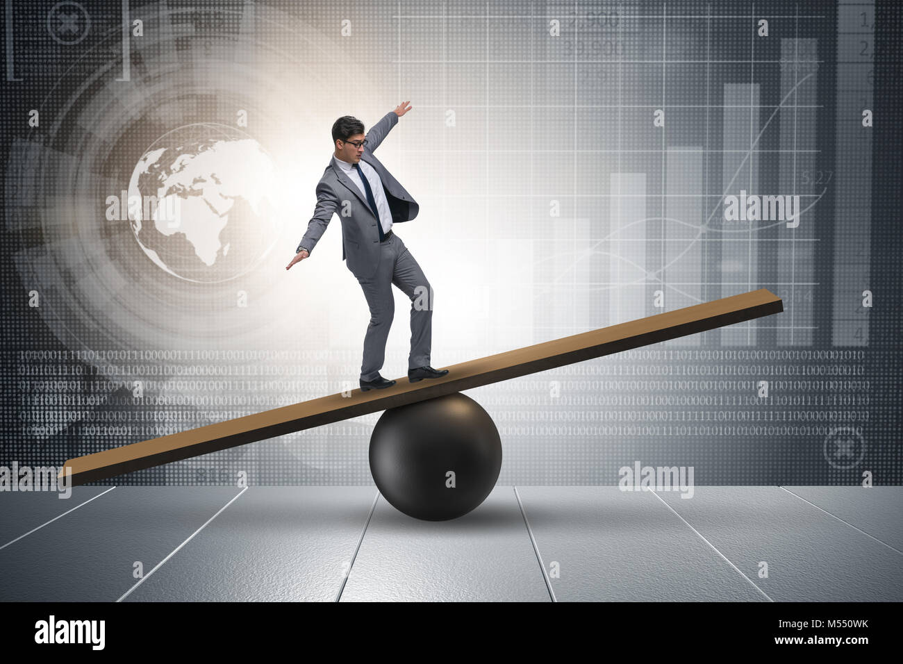 Businessman trying to balance on ball and seesaw Stock Photo - Alamy