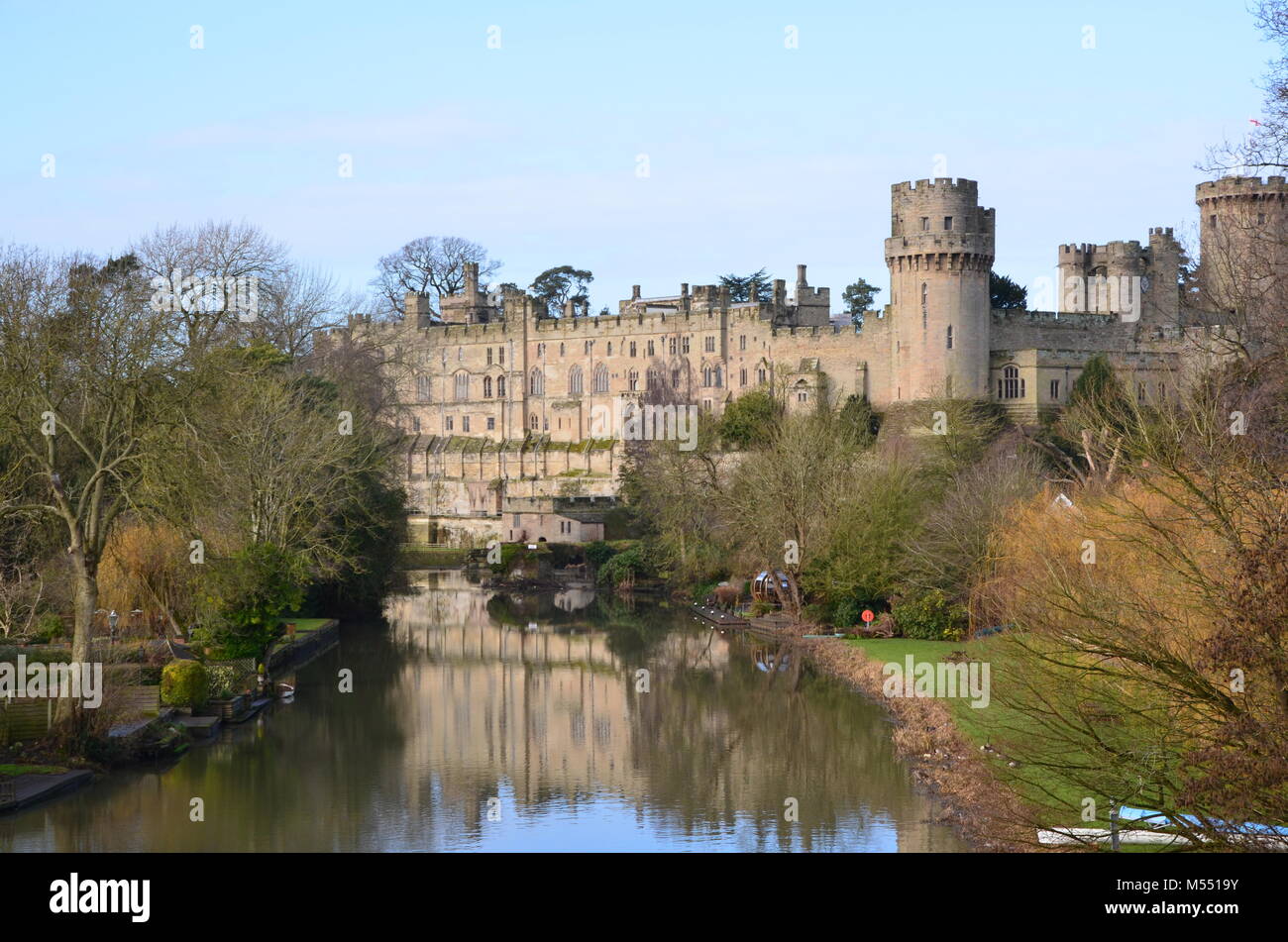 historic warwick castle reflected in the river avon UK winter scene ...