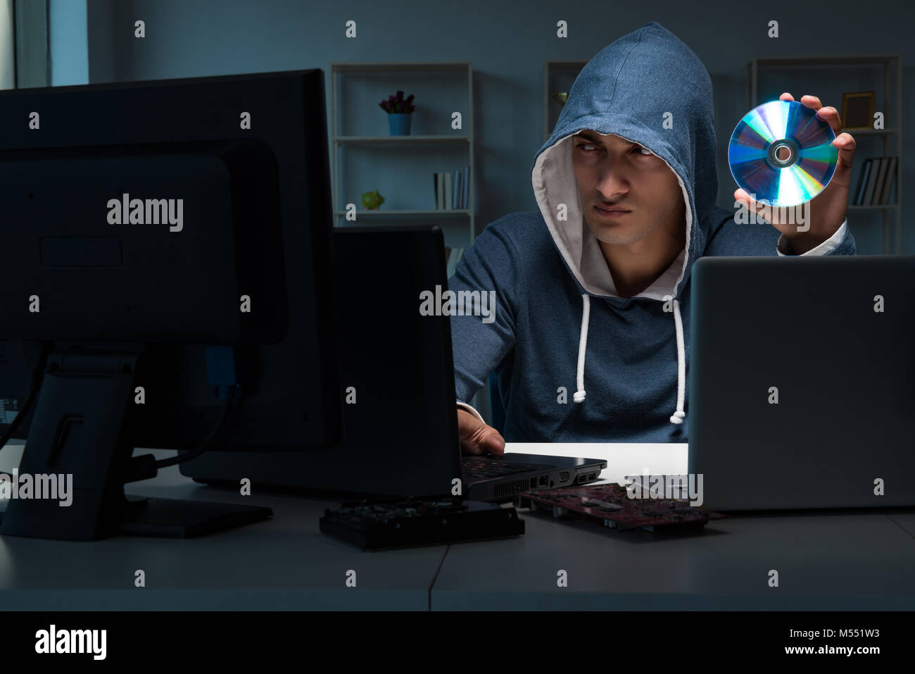 Hacker hacking computer at night Stock Photo - Alamy