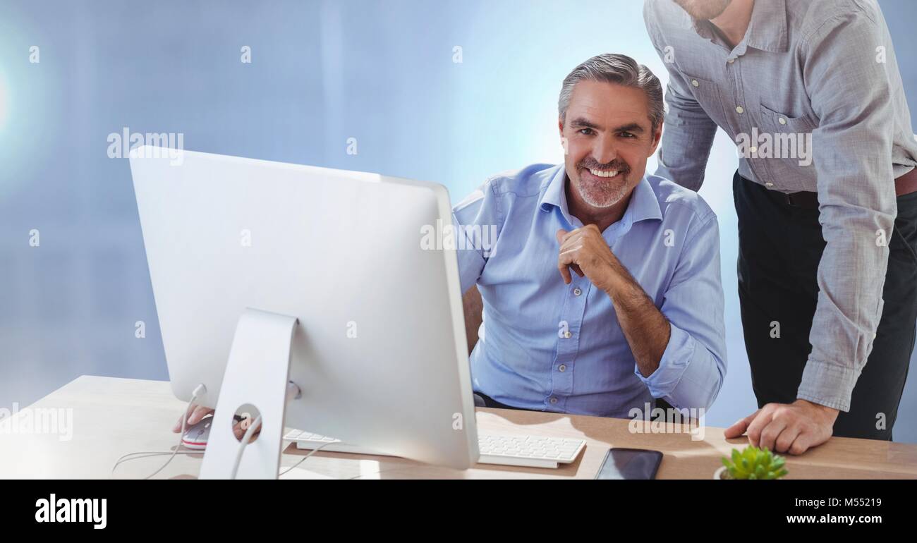 Businessmen working on computer Stock Photo - Alamy