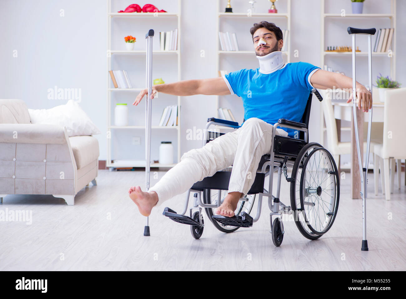 Injured young man recovering at home Stock Photo - Alamy