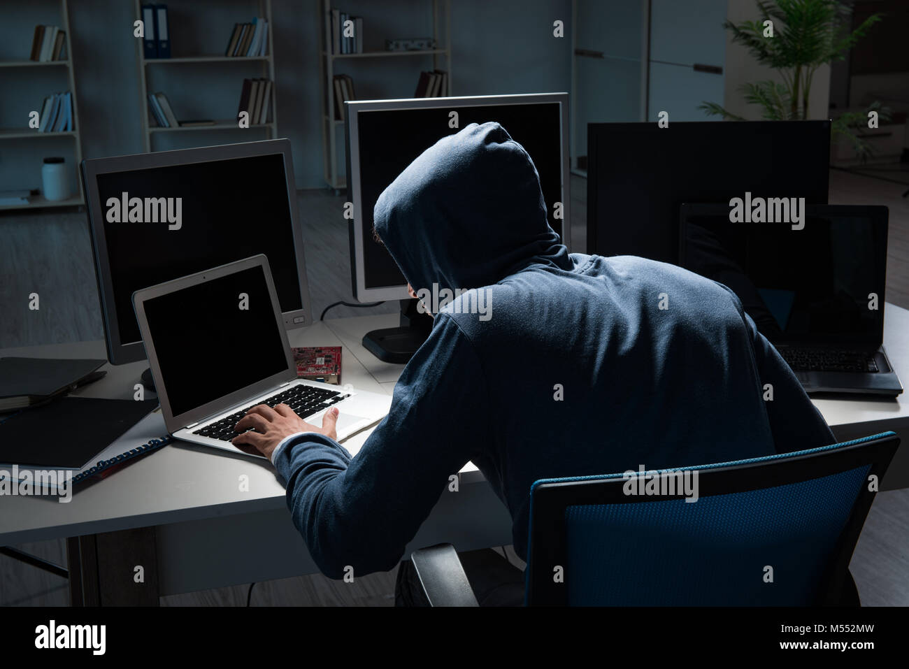Hacker hacking computer at night Stock Photo - Alamy