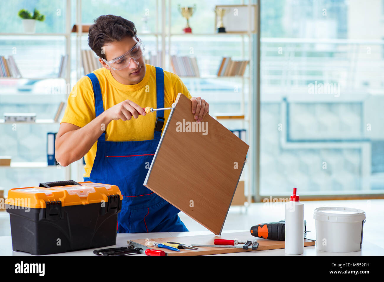 Furniture carpenter working in the workshop Stock Photo - Alamy