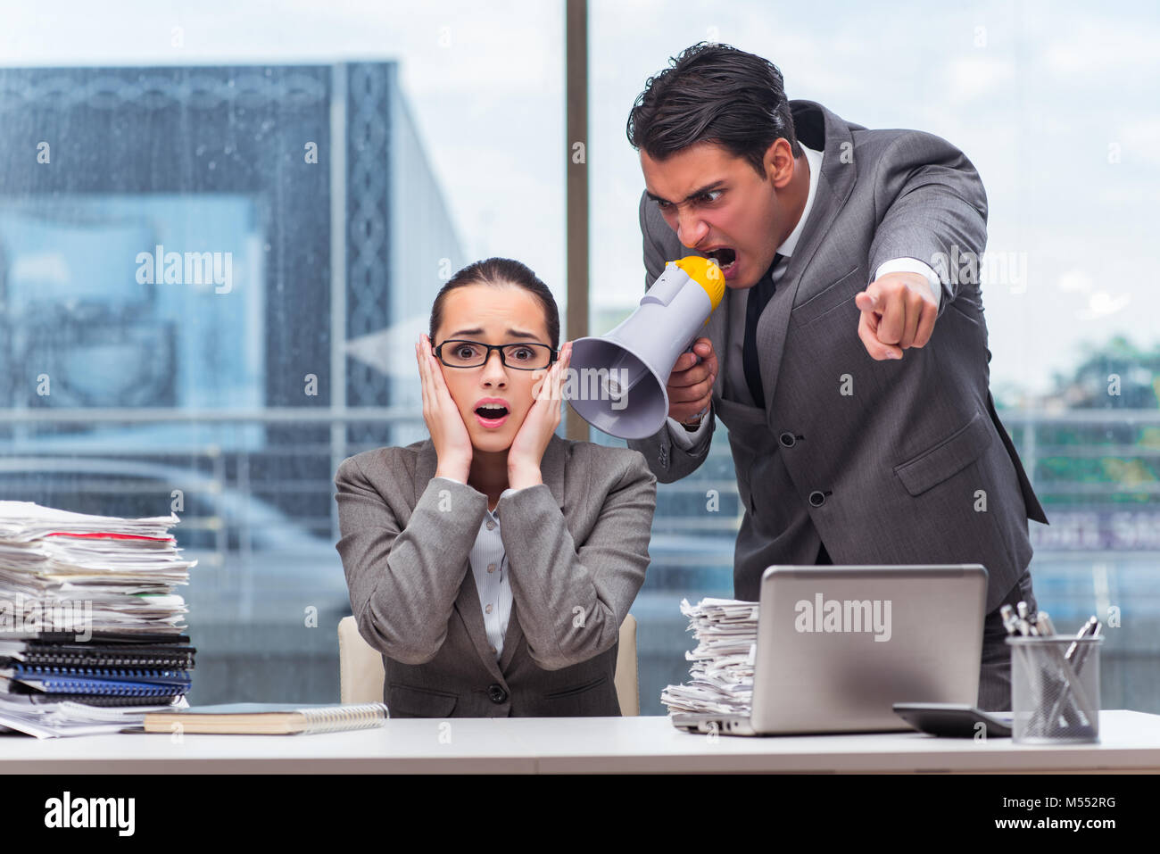 Boss yelling at his team member Stock Photo - Alamy
