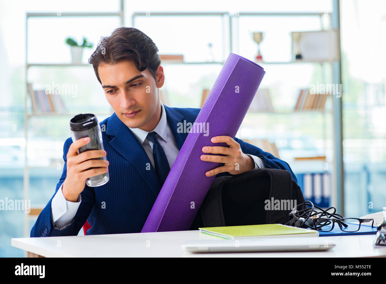 Man getting ready for sports break in the office Stock Photo - Alamy