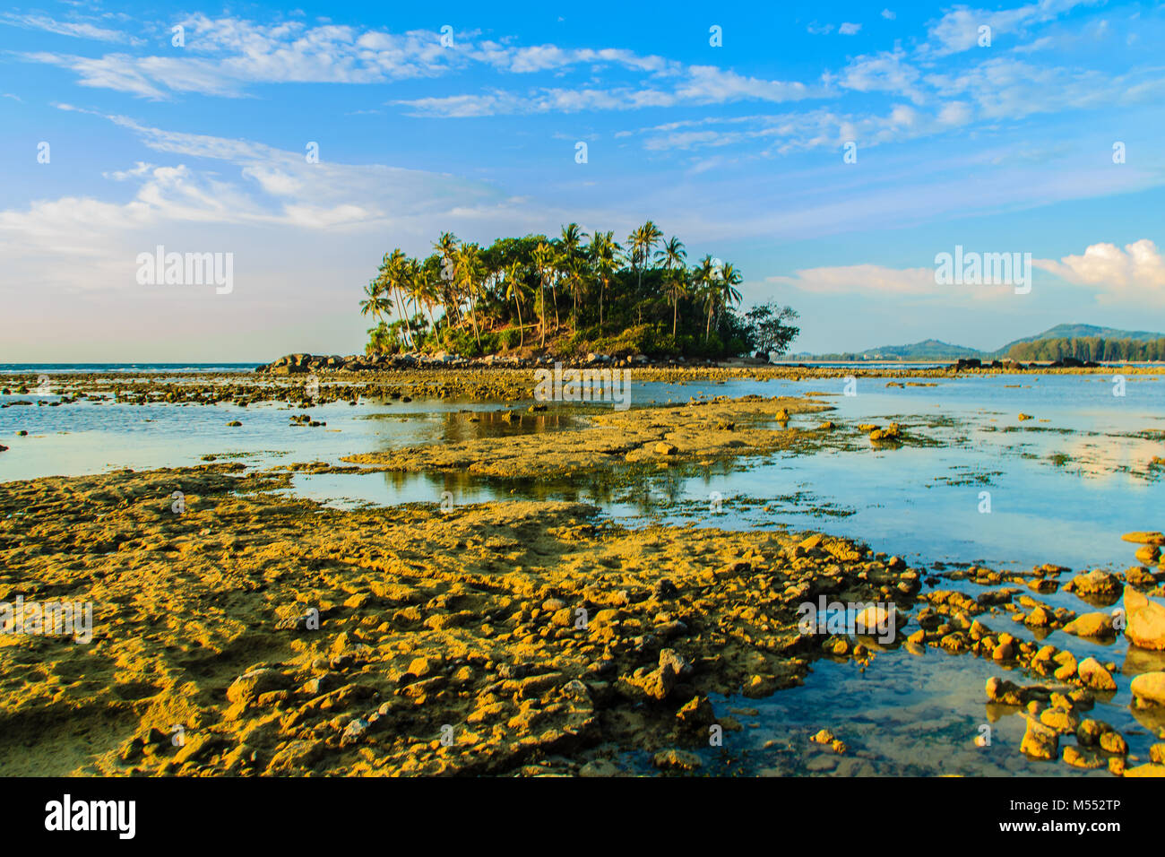 Lonely remote island with rock beach and tree when the sea water ...