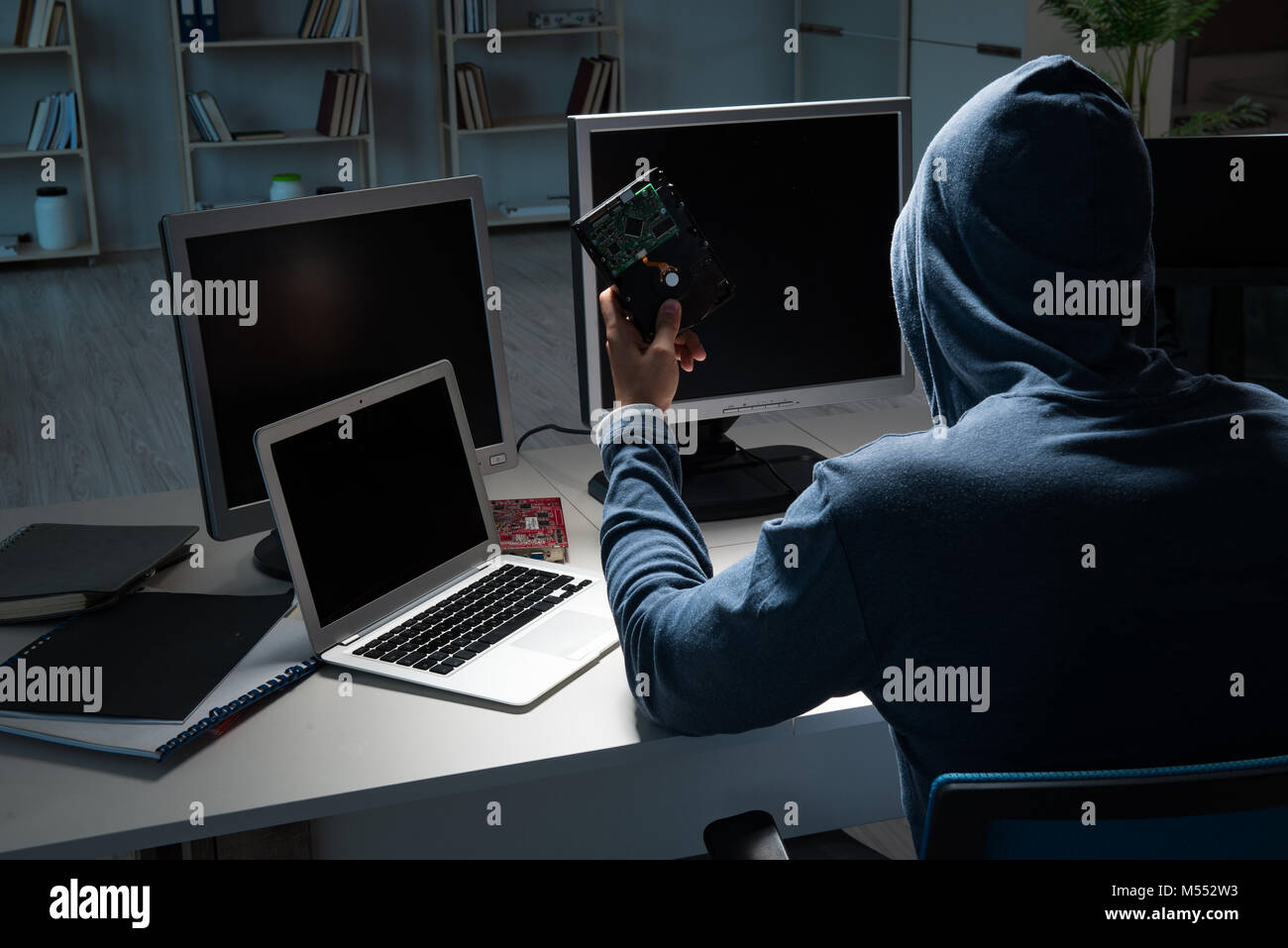 Hacker hacking computer at night Stock Photo - Alamy