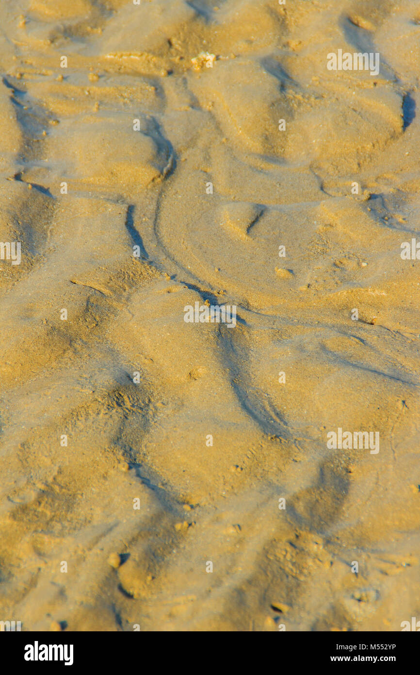 Exotic and beautiful wave pattern on the sand in the beach after sea ...