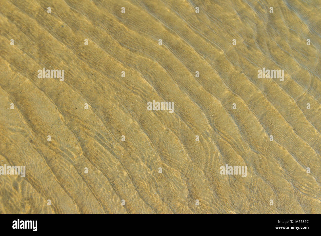 Exotic and beautiful wave pattern on the sand in the beach after sea ...