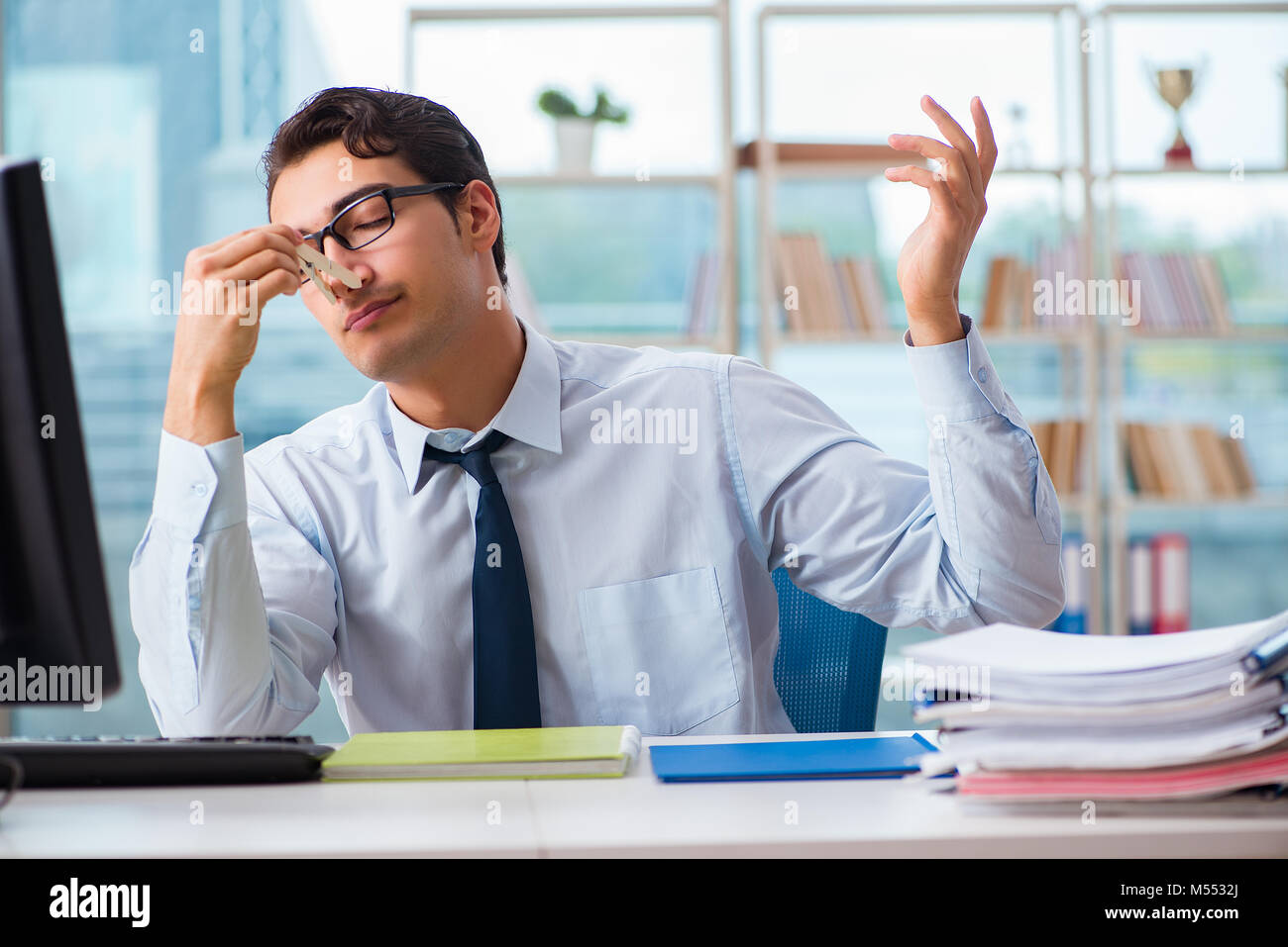 Businessman suffering from excessive armpit sweating Stock Photo - Alamy