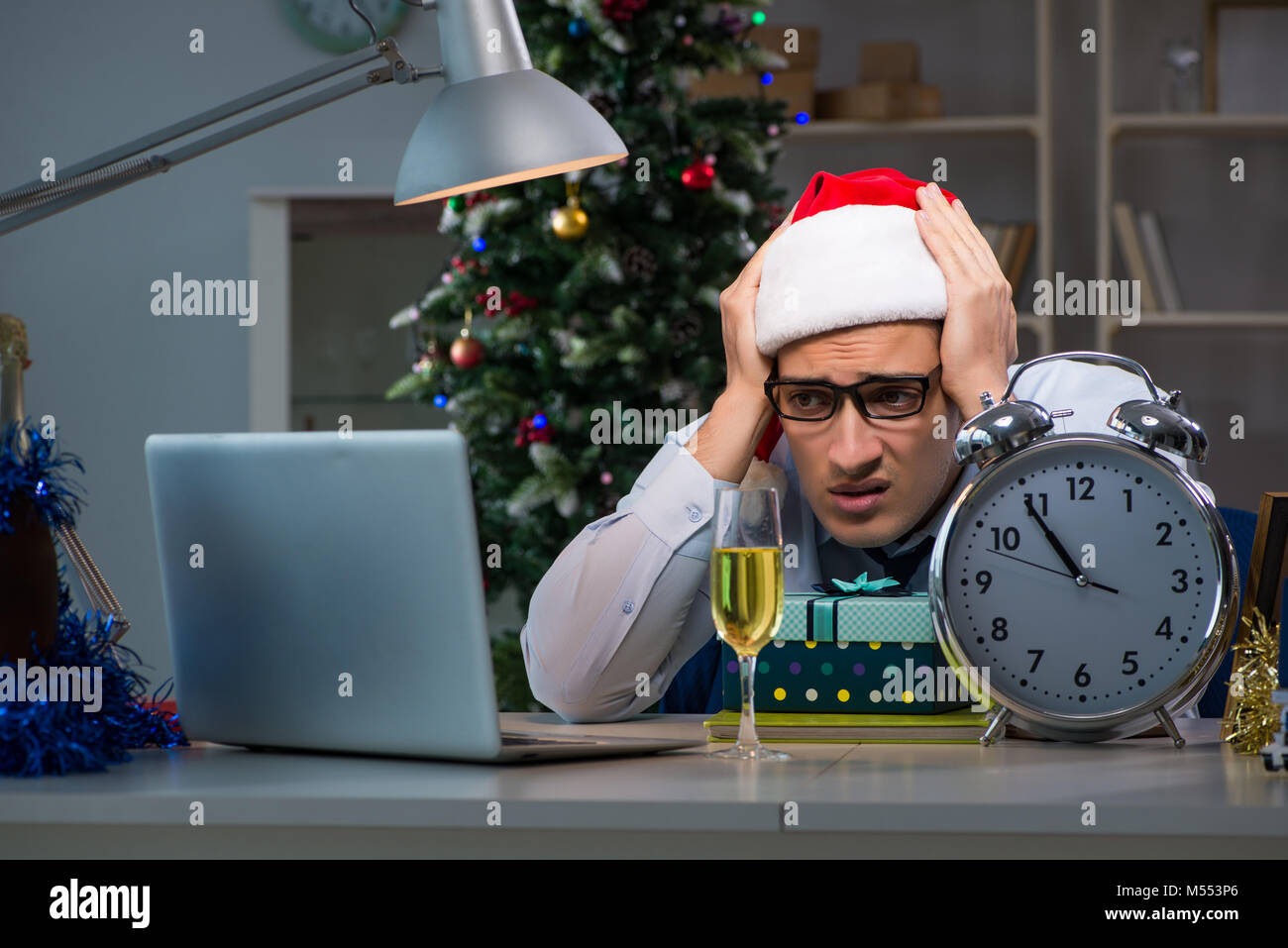 Businessman working late on christmas day in office Stock Photo - Alamy