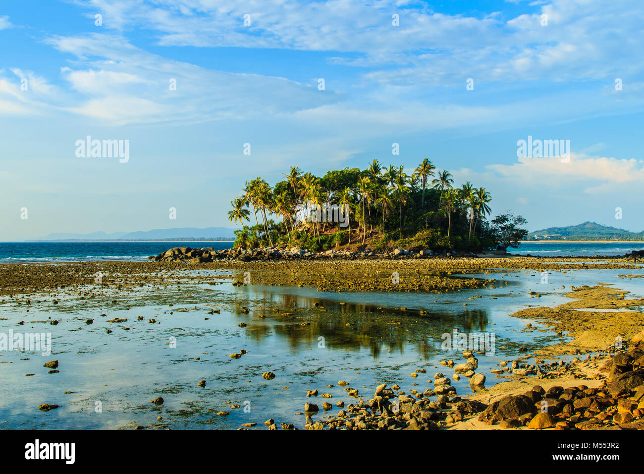 Lonely remote island with rock beach and tree when the sea water ...