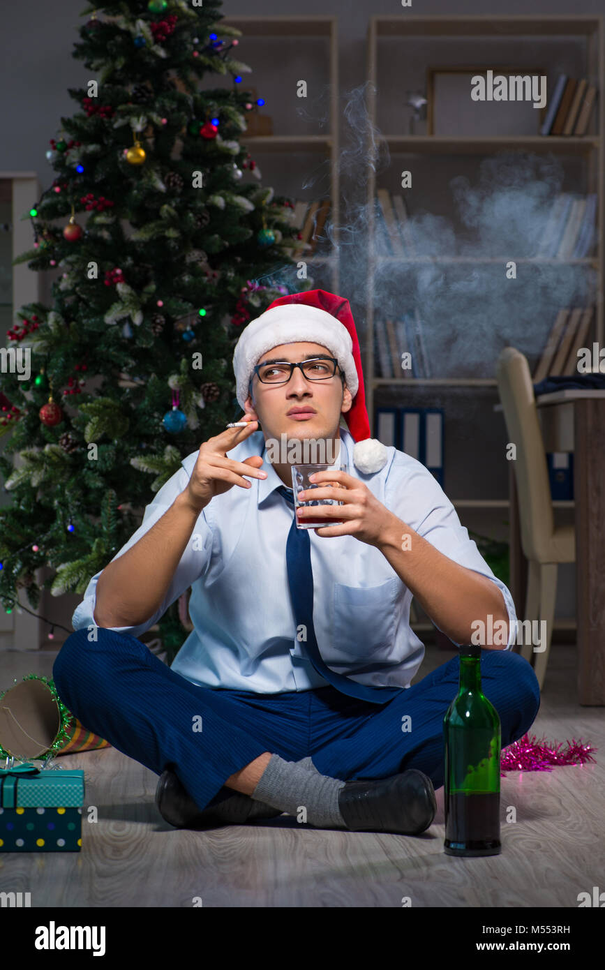 Businessman celebrating christmas at home alone Stock Photo - Alamy