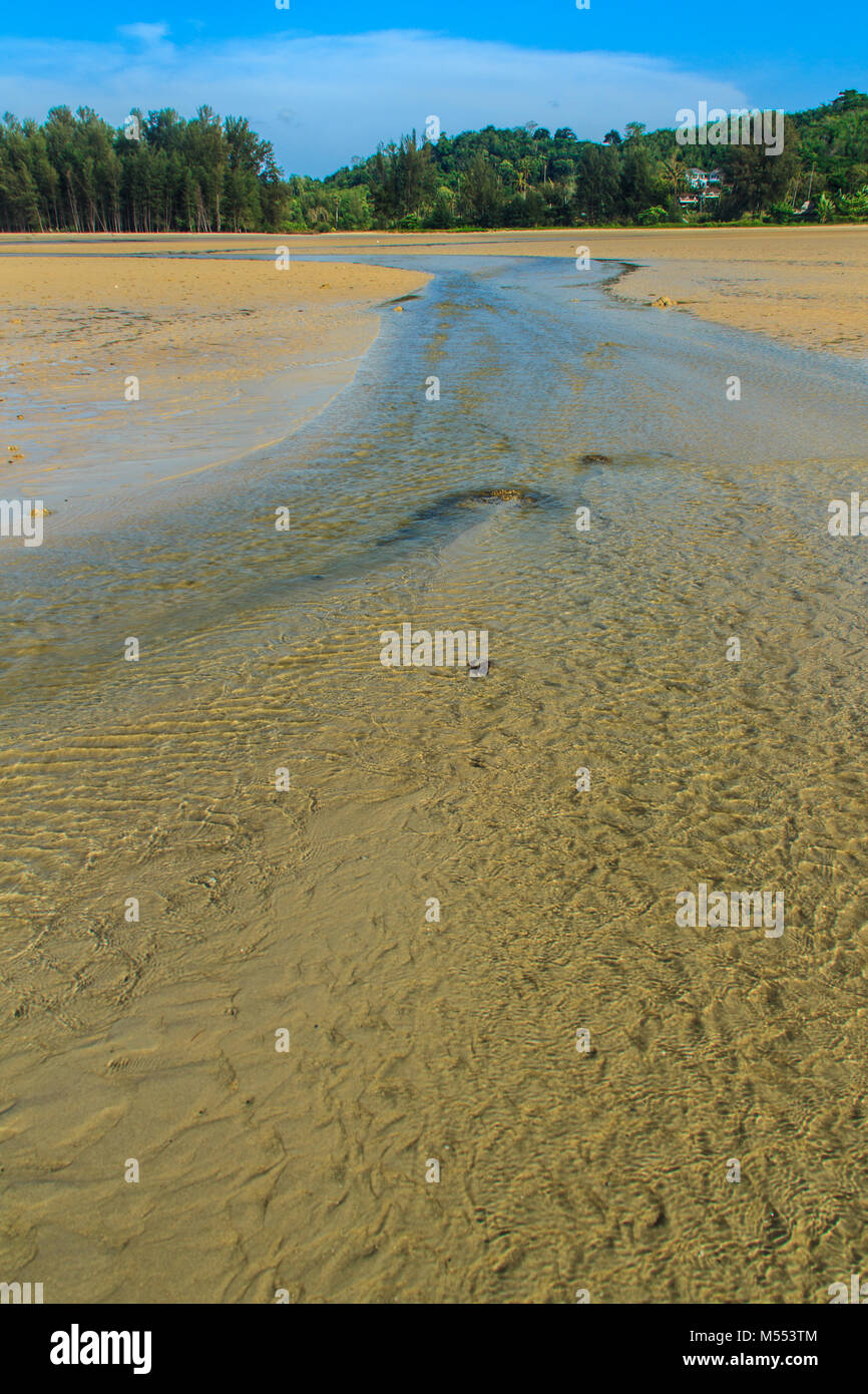 Exotic and beautiful wave pattern on the sand in the beach after sea ...