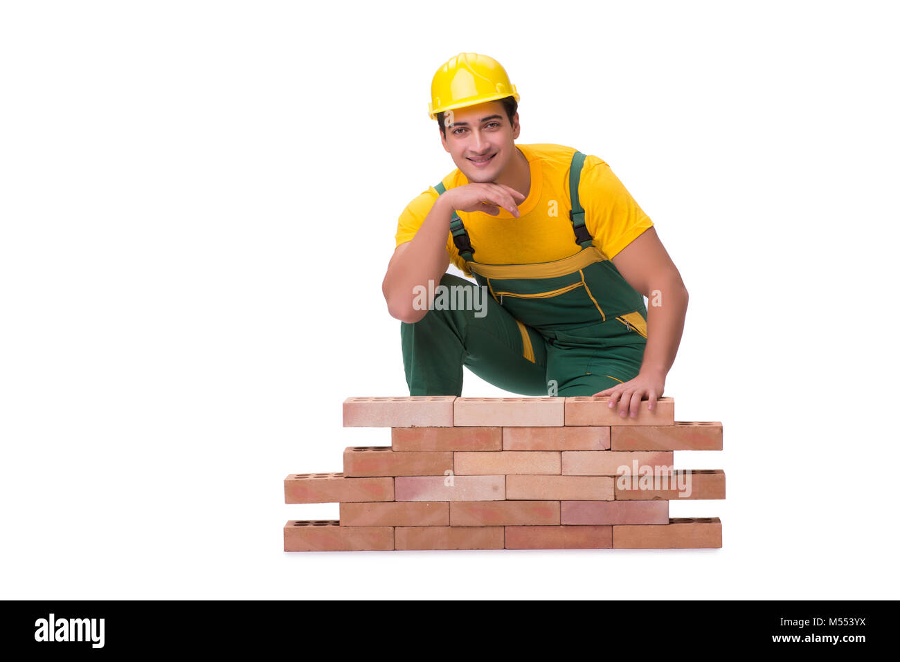 The handsome construction worker building brick wall Stock Photo - Alamy