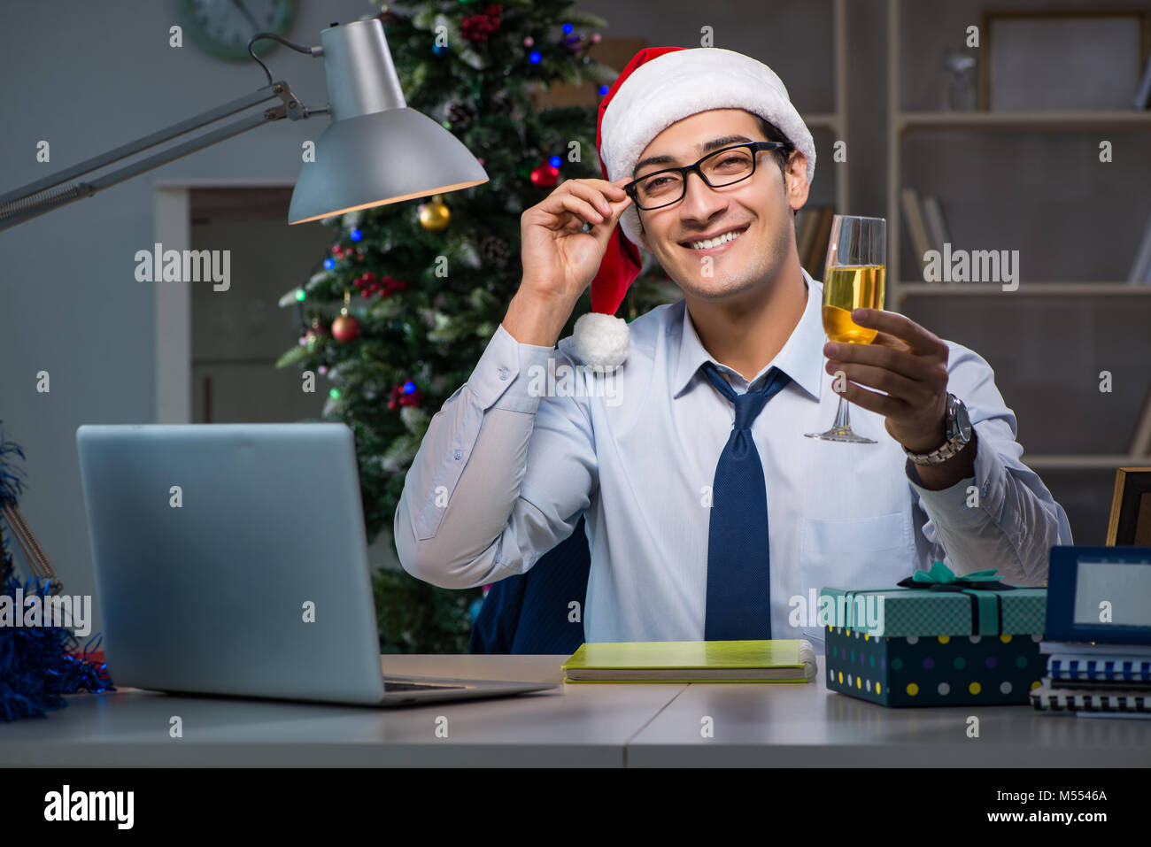 Businessman working late on christmas day in office Stock Photo - Alamy