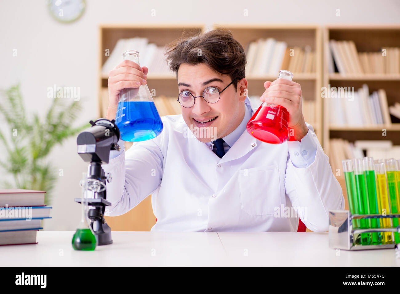 Mad crazy scientist doctor doing experiments in a laboratory Stock ...