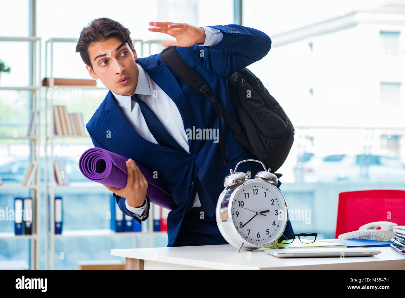 Man getting ready for sports break in the office Stock Photo - Alamy
