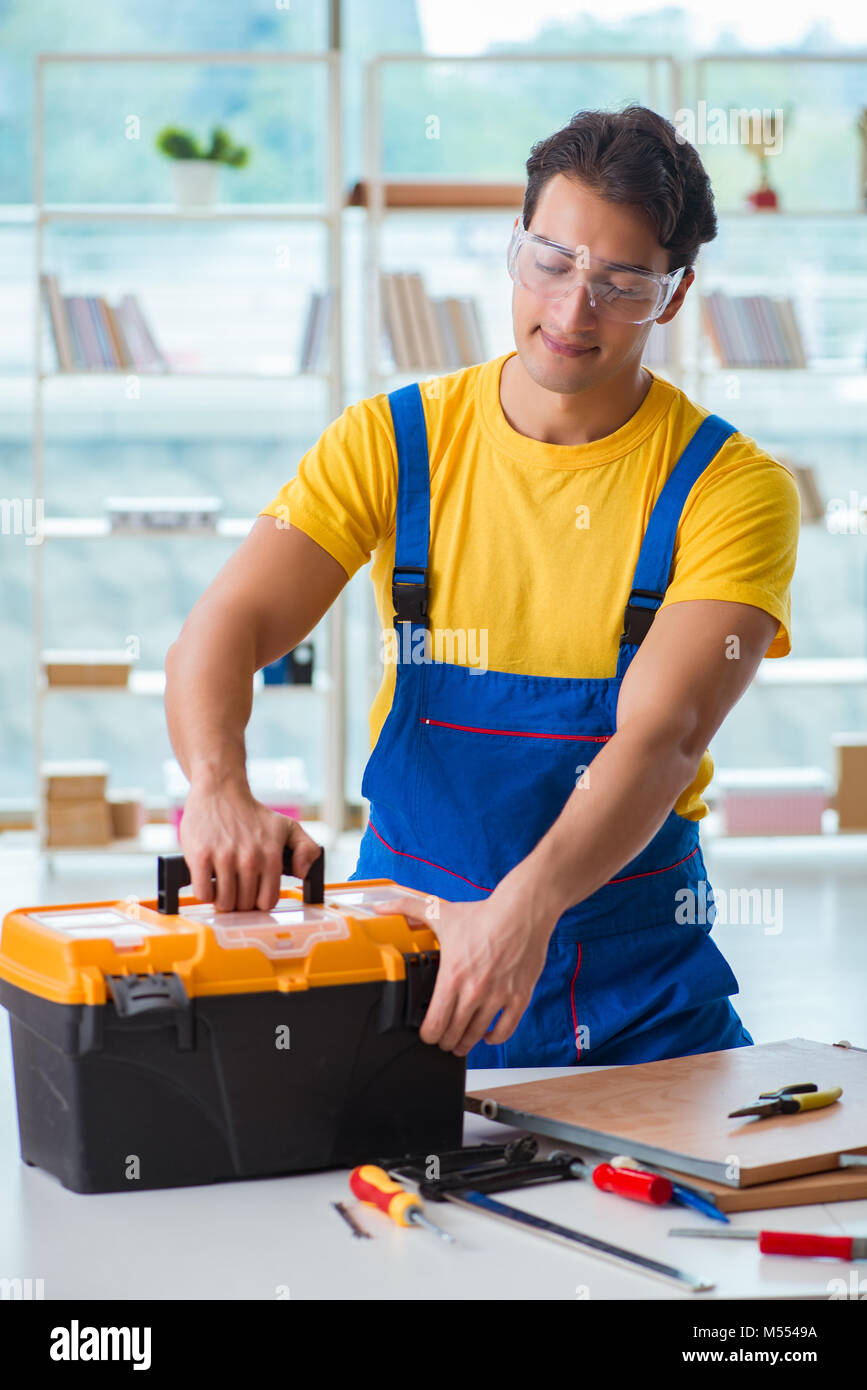 Furniture carpenter working in the workshop Stock Photo - Alamy