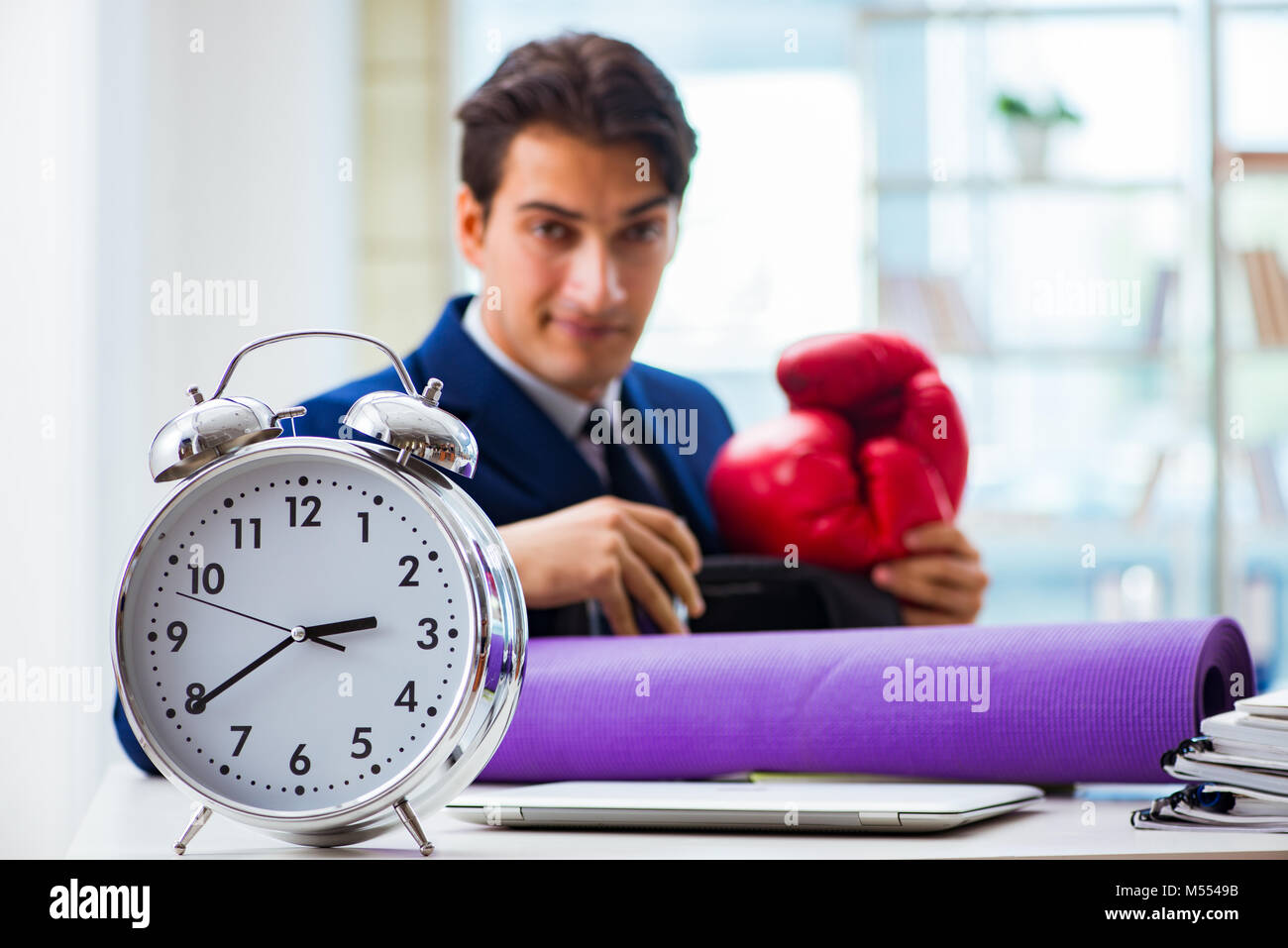 Man with boxing gloves in the office Stock Photo - Alamy