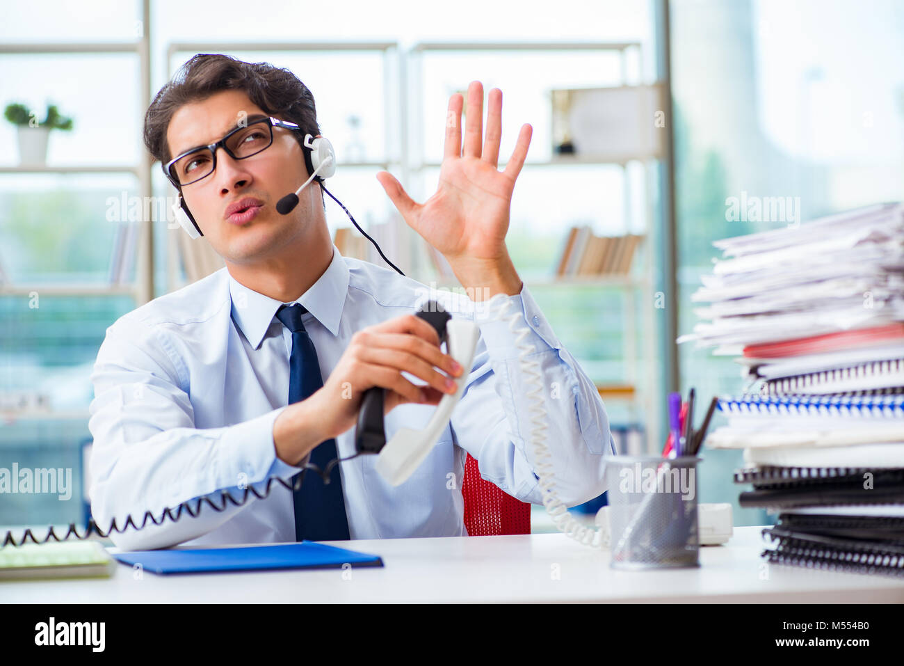 Unhappy angry call center worker frustrated with workload Stock Photo ...