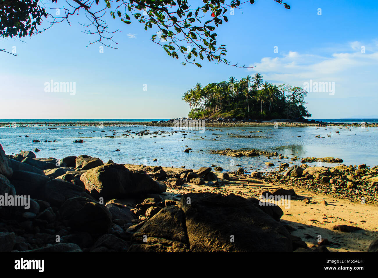Lonely remote island with rock beach and tree when the sea water ...